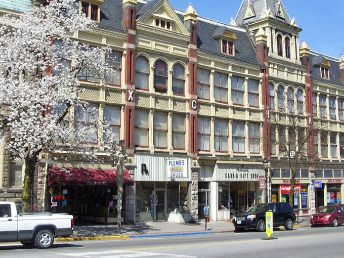 Spring blossoms frame these Victorian beauties like nature's own picture frame, creating a scene worthy of a postcard.