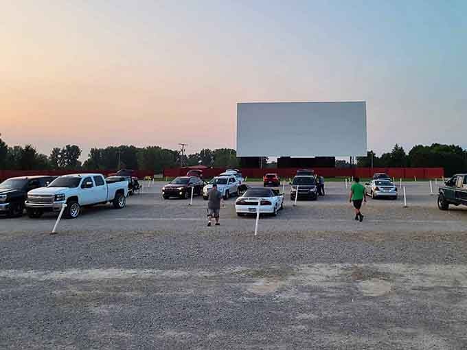 Golden hour at the drive-in means finding your perfect spot before the show begins under painted skies.