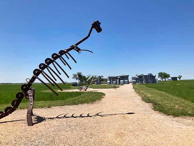Prehistoric meets automotive at Carhenge. This metal dinosaur guards the approach to Alliance's famous car monument.