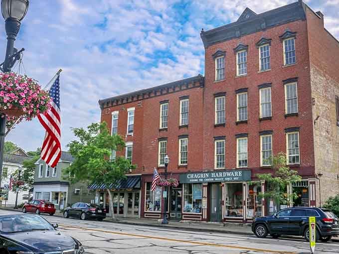 That red brick hardware store has stood here for generations, anchoring a downtown that time graciously preserved.