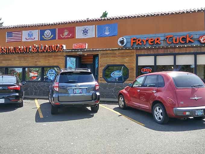 Military flags proudly wave above this unassuming chicken haven, promising a patriotic feast for your taste buds.