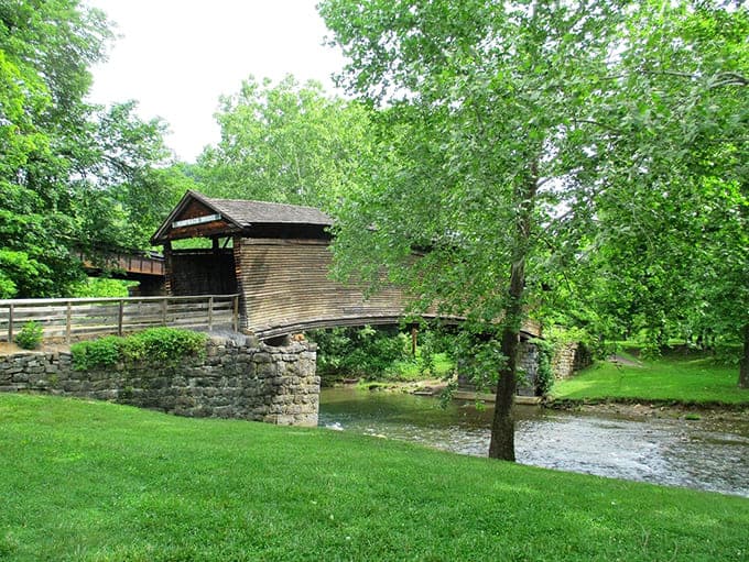 This historic covered bridge over peaceful waters has been standing strong since the 1800s, still picture-perfect today.