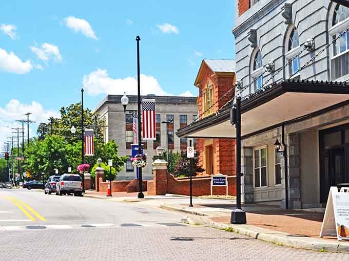 Those American flags wave over streets where history and affordability shake hands like old friends reuniting.