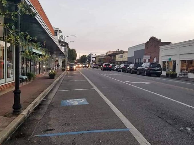Evening light softens the main street as locals finish their day in this charming bayside community.