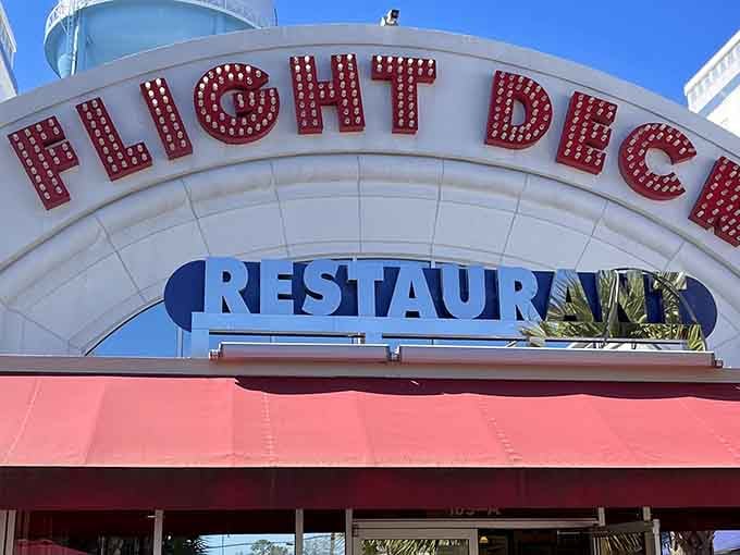 Under bright blue skies, this retro-style facade beckons hungry travelers seeking meals with a side of airplane magic.