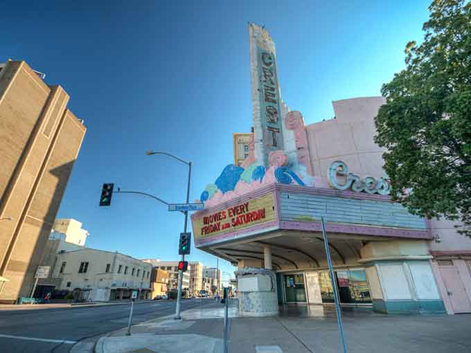 That vintage Crest Theatre marquee glows like a beacon, reminding us when going to the movies was an event.
