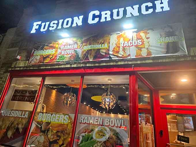 Those glowing disco balls in the windows promise a party, and that bold red storefront delivers flavor around the clock.