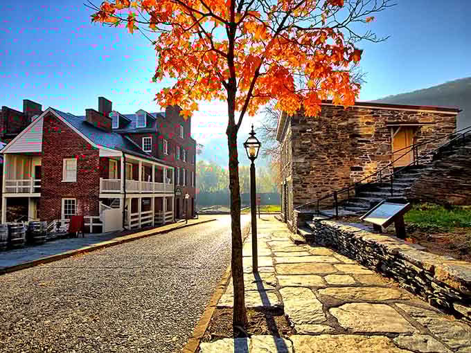 Fall colors frame historic Harpers Ferry's stone buildings, where history and nature create the perfect small-town escape.