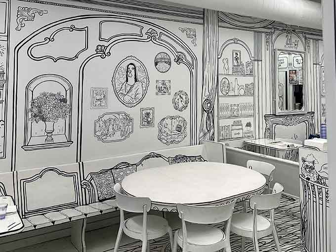 Every surface looks hand-drawn, from the ornate furniture to the picture frames on these whimsical walls.