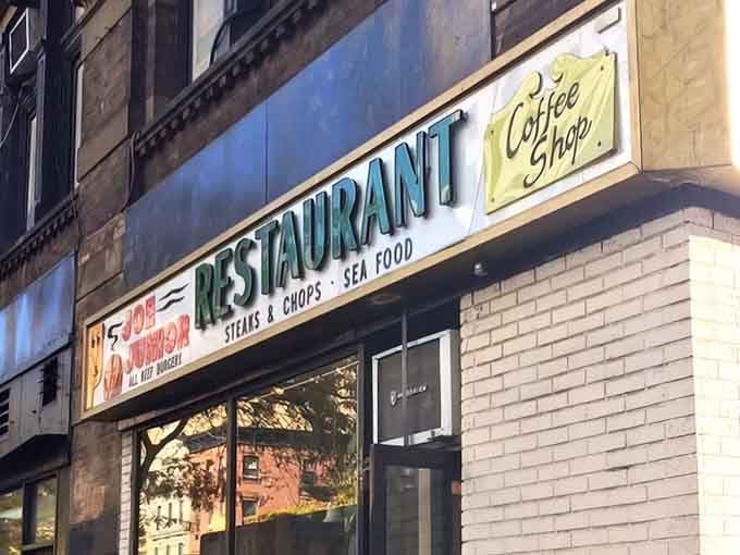 The classic green and red signage of Joe Jr. stands as a defiant reminder that some things in New York refuse to change&mdash;thankfully.