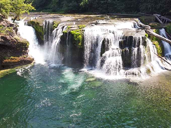 That emerald water looks like something from a travel magazine, and those moss-covered cascades are absolutely mesmerizing.