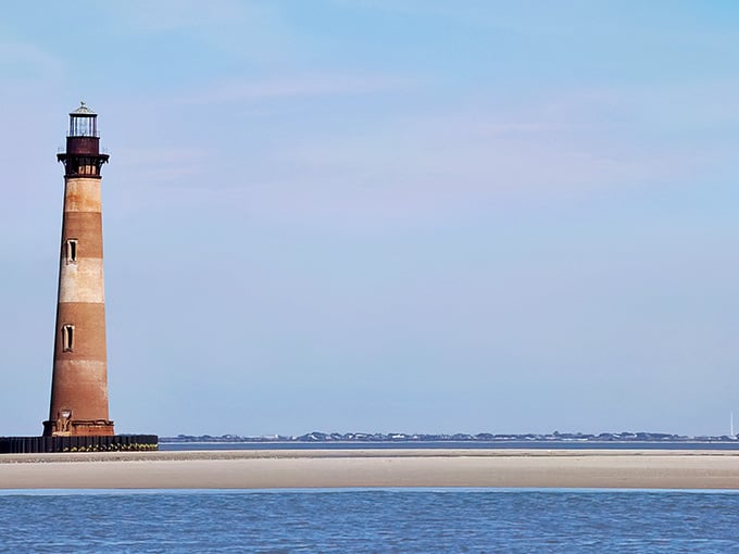 Low tide reveals endless sandbars around this historic sentinel, creating a photographer's dream at golden hour.