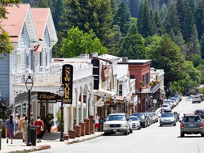 Victorian storefronts climb the hillside where pine trees meet blue sky and Gold Rush dreams still linger.