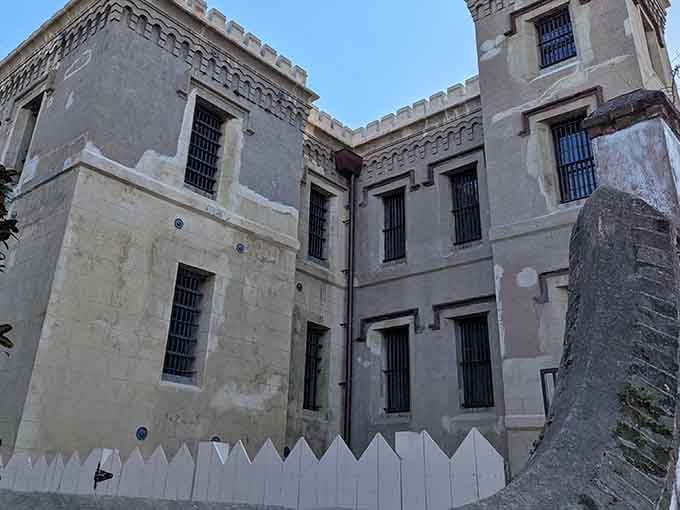 Those barred windows and weathered walls tell stories no bedtime story ever would—history with an edge.