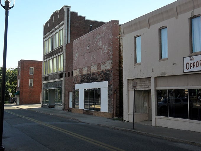 These storefronts have witnessed decades of change, standing proud with weathered facades that tell authentic stories.