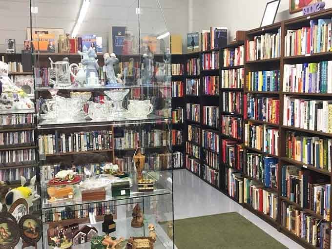 Crystal glassware meets endless books in perfectly organized aisles that make browsing feel like a treasure hunt.