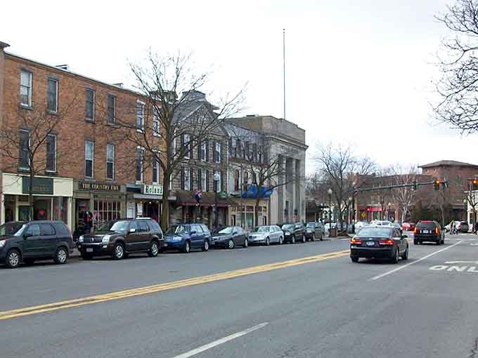 Classic brick storefronts line this lakeside street where every building tells a story from another century.
