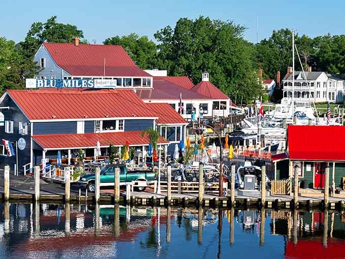 Red roofs reflecting in calm harbor waters create a postcard scene that'll make your Instagram followers seriously jealous.