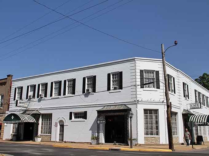 That crisp white colonial building with black shutters stands like a proud grandmother watching over the historic downtown.