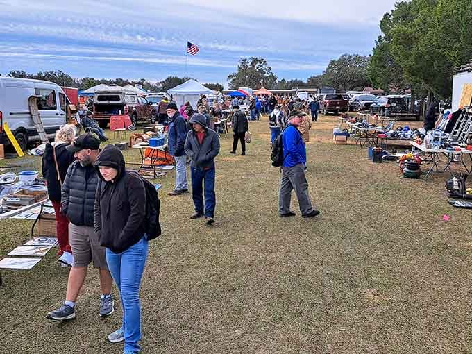 The American flag waves over acres of outdoor bargains where crowds gather for Monday morning magic.