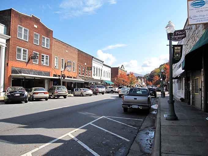 Fall colors frame Sylva's downtown, where parked cars line the street outside local restaurants and shops housed in century-old buildings.