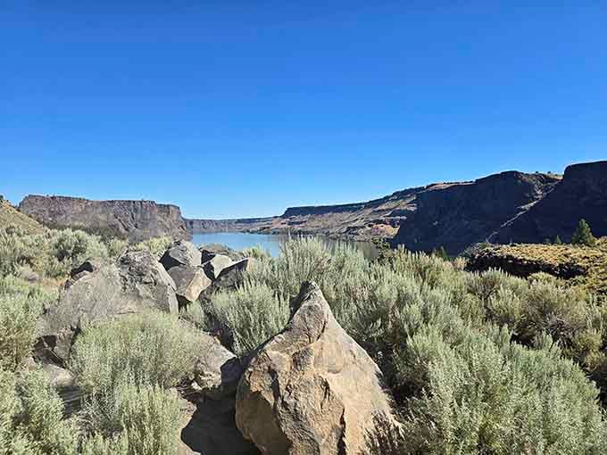 Desert meets water where ancient lava flows carved these towering cliffs into natural masterpieces worth every mile.