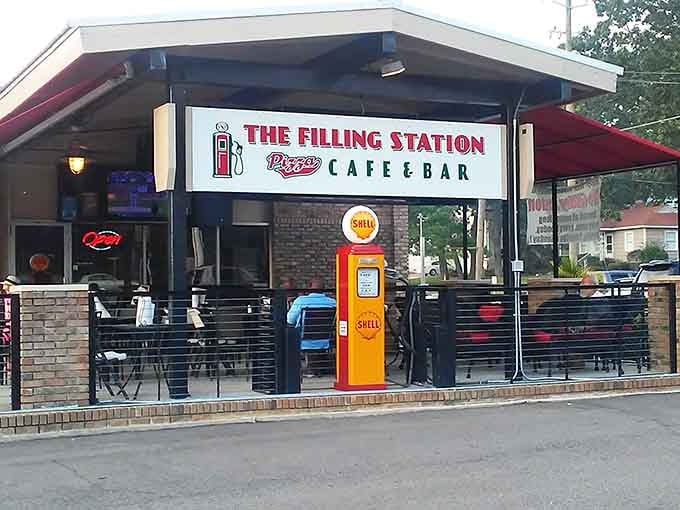 That vintage gas pump isn't pumping fuel anymore—it's guarding the entrance to pizza paradise at The Filling Station!