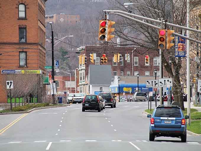 Traffic lights guide you through streets lined with history, where every corner holds a piece of working-class Connecticut charm.
