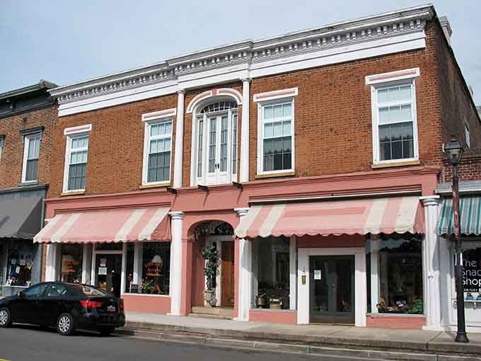 Those pink-and-white striped awnings add a touch of old-fashioned elegance that never goes out of style.