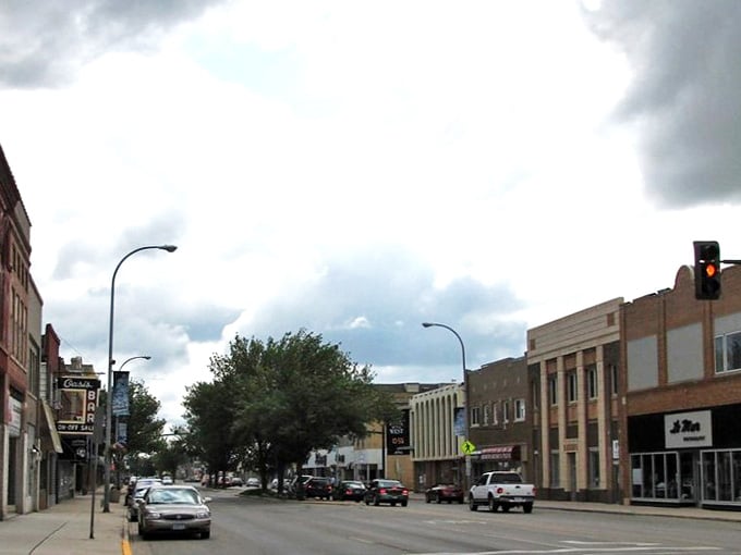 Tree-lined streets create natural canopies that make summer strolls feel like walking through a postcard come alive.