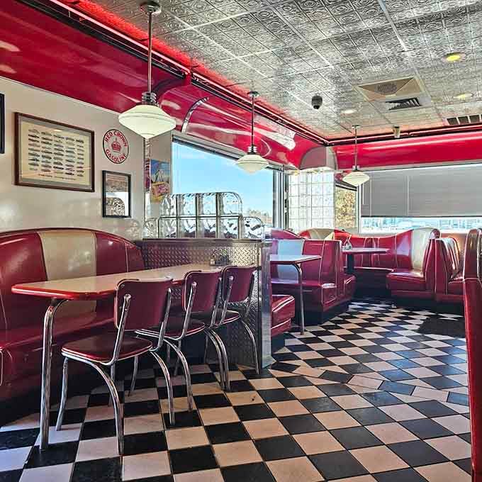 Red vinyl booths and checkered floors create the perfect setting for your next memorable meal.