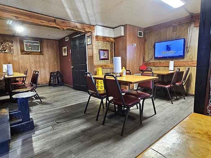 Wood paneling and simple tables create the kind of no-nonsense atmosphere where great barbecue feels right at home.