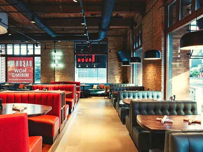 Red booths against exposed brick create the perfect backdrop for your bacon pilgrimage and inevitable food coma.