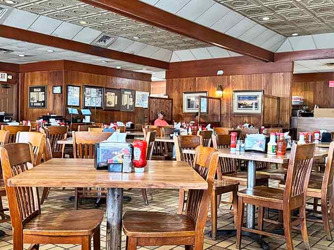 Wood paneling and simple tables create the kind of honest atmosphere where great barbecue belongs.
