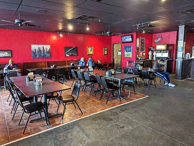 Those red walls radiate pure pizza energy, setting the stage for slices that'll make your jaw drop faster than your fork.