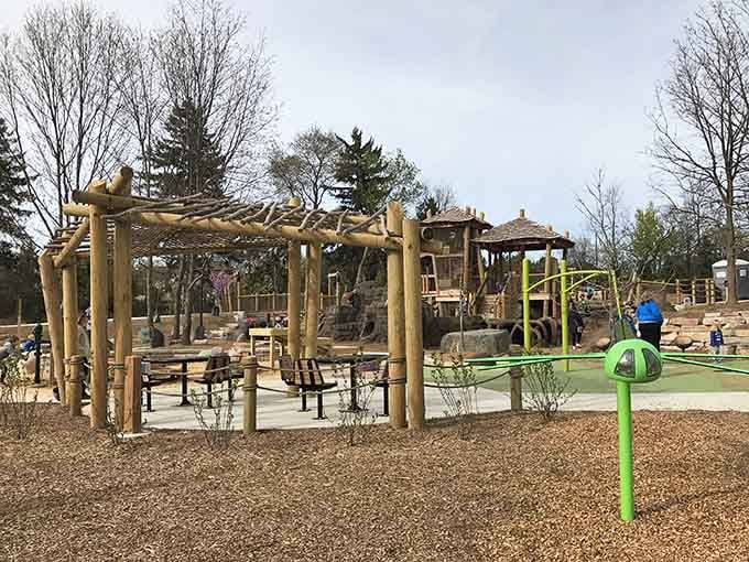 Natural wood structures that make you wonder if talented beavers moonlight as playground designers on weekends.