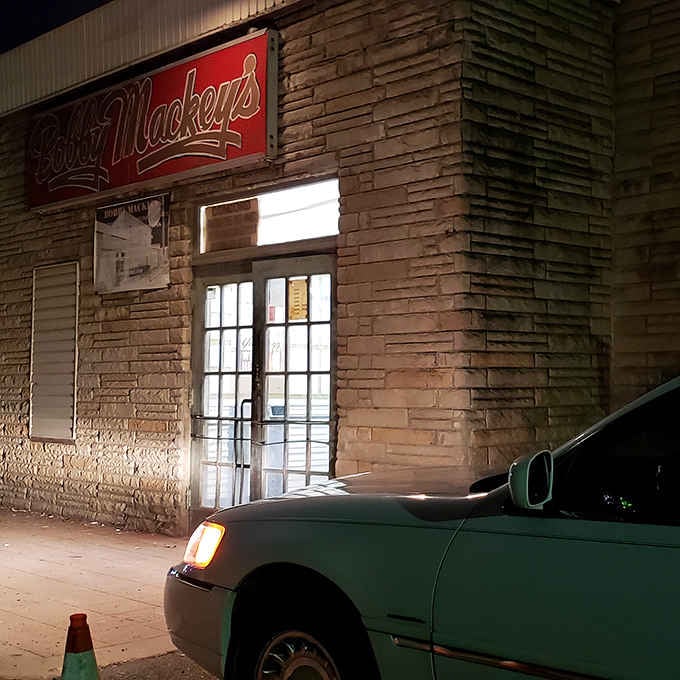 That entrance glows invitingly at night, though what waits inside might be more than just good music.