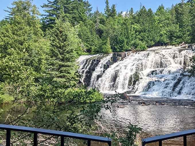 The wide cascade spreads across the rock face like liquid silver, proving Michigan's got serious waterfall game.