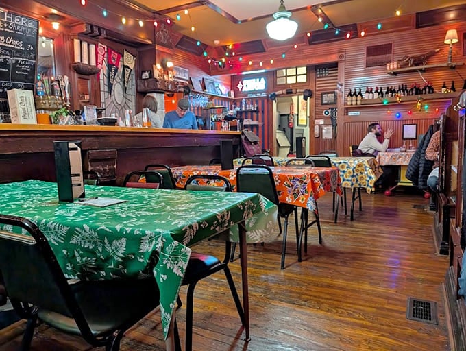 Colorful tablecloths and string lights create an atmosphere where gourmet food meets small-town charm without any pretense whatsoever.