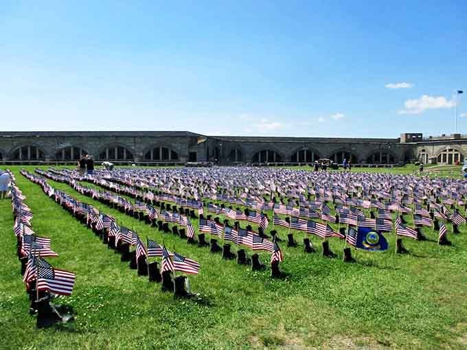 A sea of American flags creates a poignant memorial on the parade grounds. Each one represents a fallen hero&mdash;a reminder that freedom isn't free.