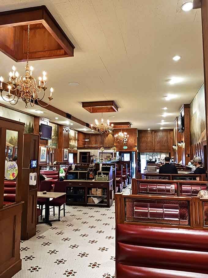 Step inside and those chandeliers, red booths, and vintage tiles transport you straight to dining's golden age.