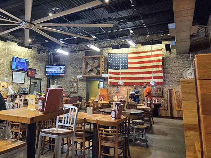 Exposed brick, high ceilings, and Old Glory watching over your meal. This is barbecue done right, America.