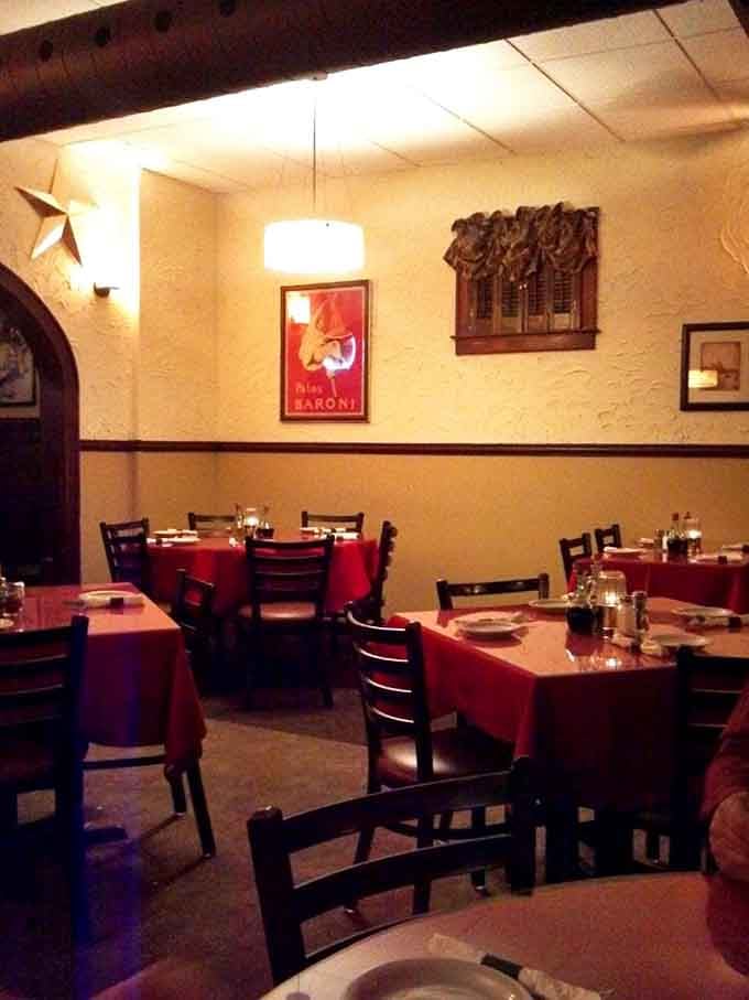 Red tablecloths and warm lighting create the kind of atmosphere where every meal feels like a celebration worth attending.