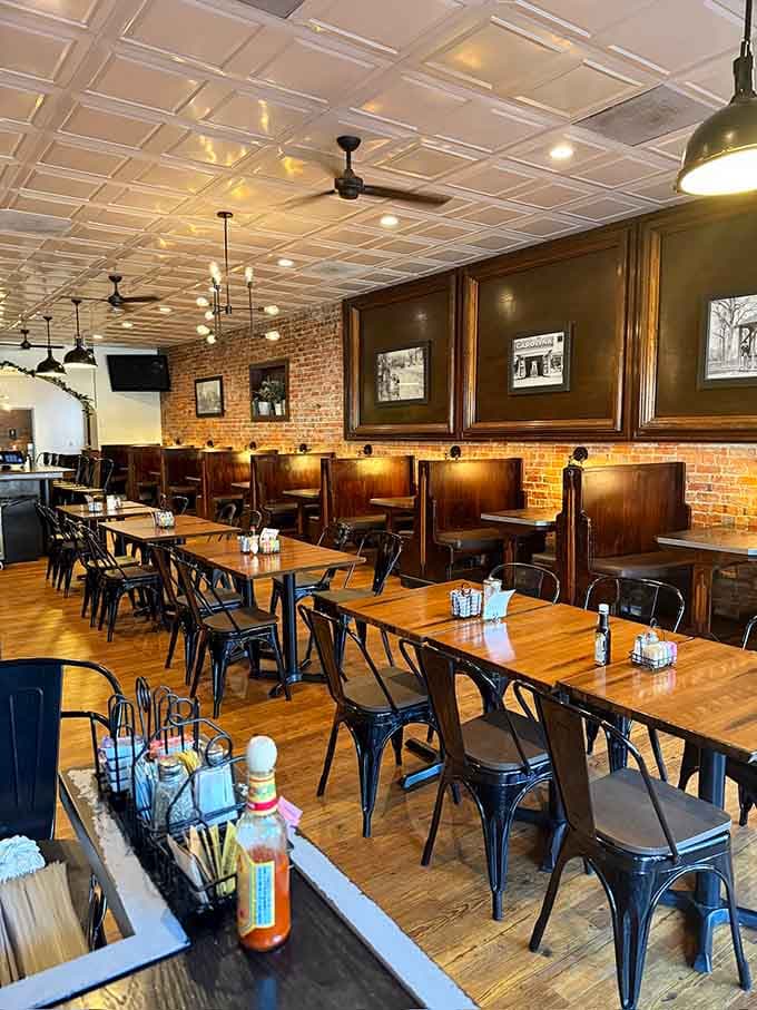 Exposed brick, wooden booths, and tin ceilings create the kind of timeless atmosphere money can't buy, only time.