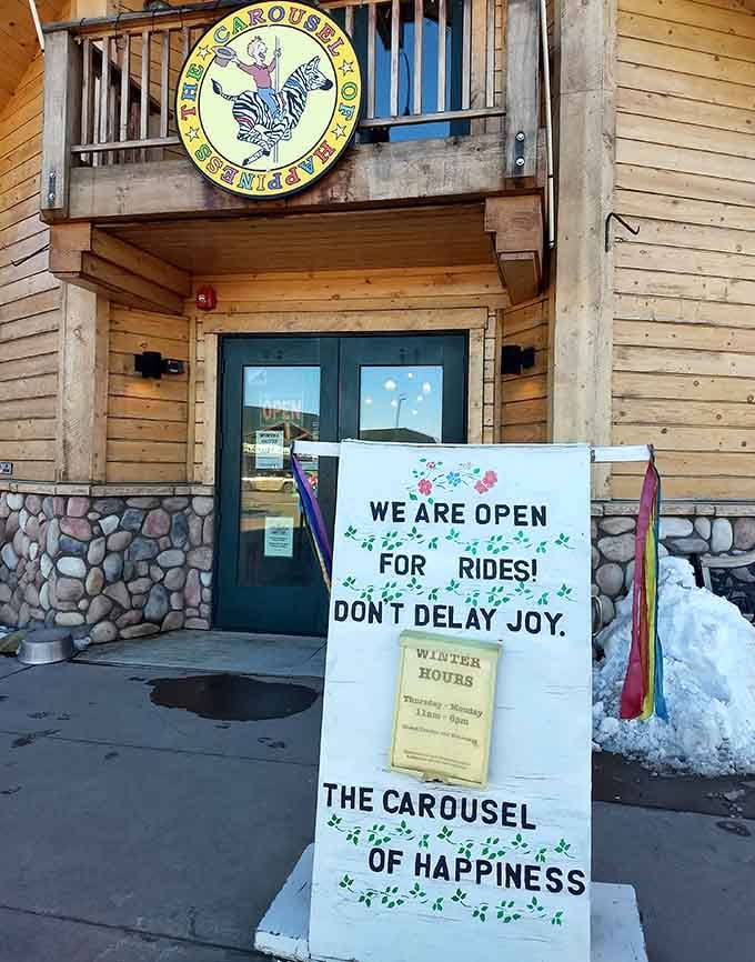 Don't Delay Joy might be the best life advice ever printed on a sandwich board sign.