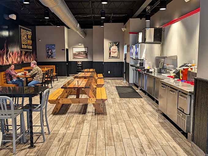 Wood-toned tables and flame murals set the stage where smoky dreams become delicious reality every single day.