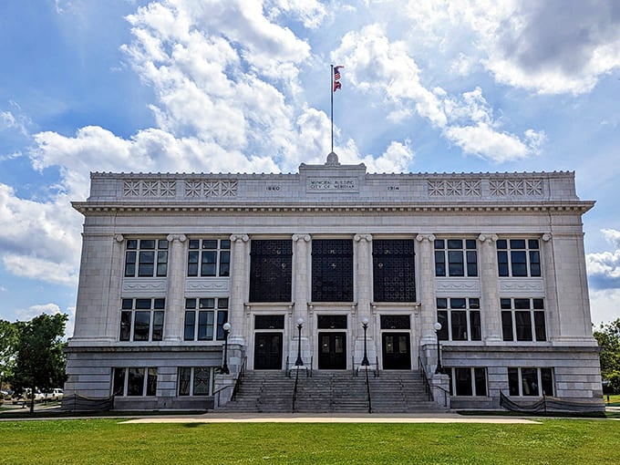 Meridian's City Hall stands proudly against blue Mississippi skies, its gleaming white columns and classical design a testament to civic ambition.