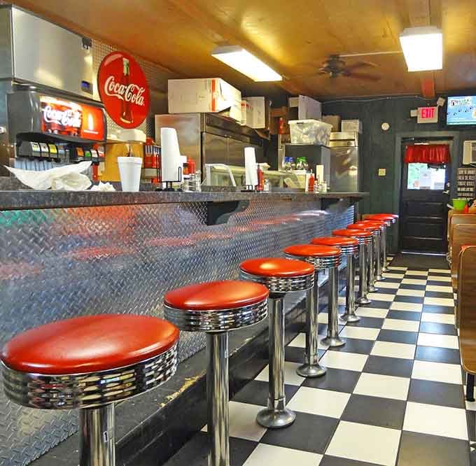 Chrome stools and checkered floors: where every seat feels like the best seat in the house.