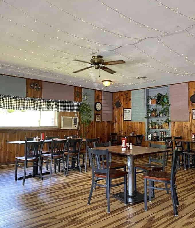 Wood paneling and string lights create the kind of cozy atmosphere where calories don't count.