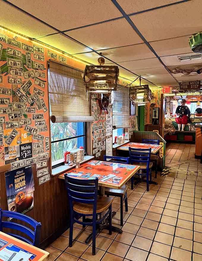 Dollar bills wallpaper the place like financial confetti, proof that happy diners leave their mark everywhere.